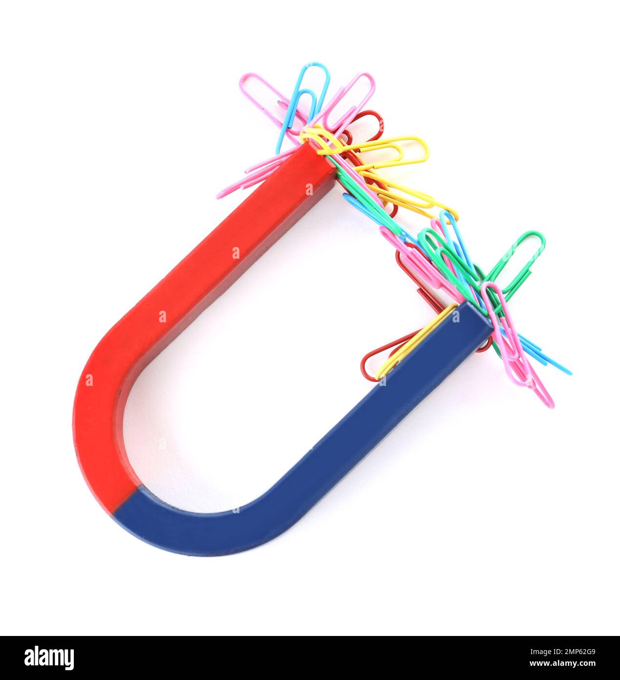 Magnet attracting paper clips on white background, top view Stock Photo ...