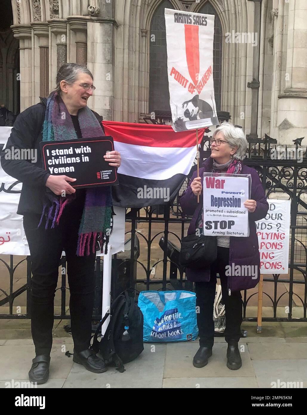 Campaign Against Arms Trade (CAAT) protesters outside the Royal Courts ...