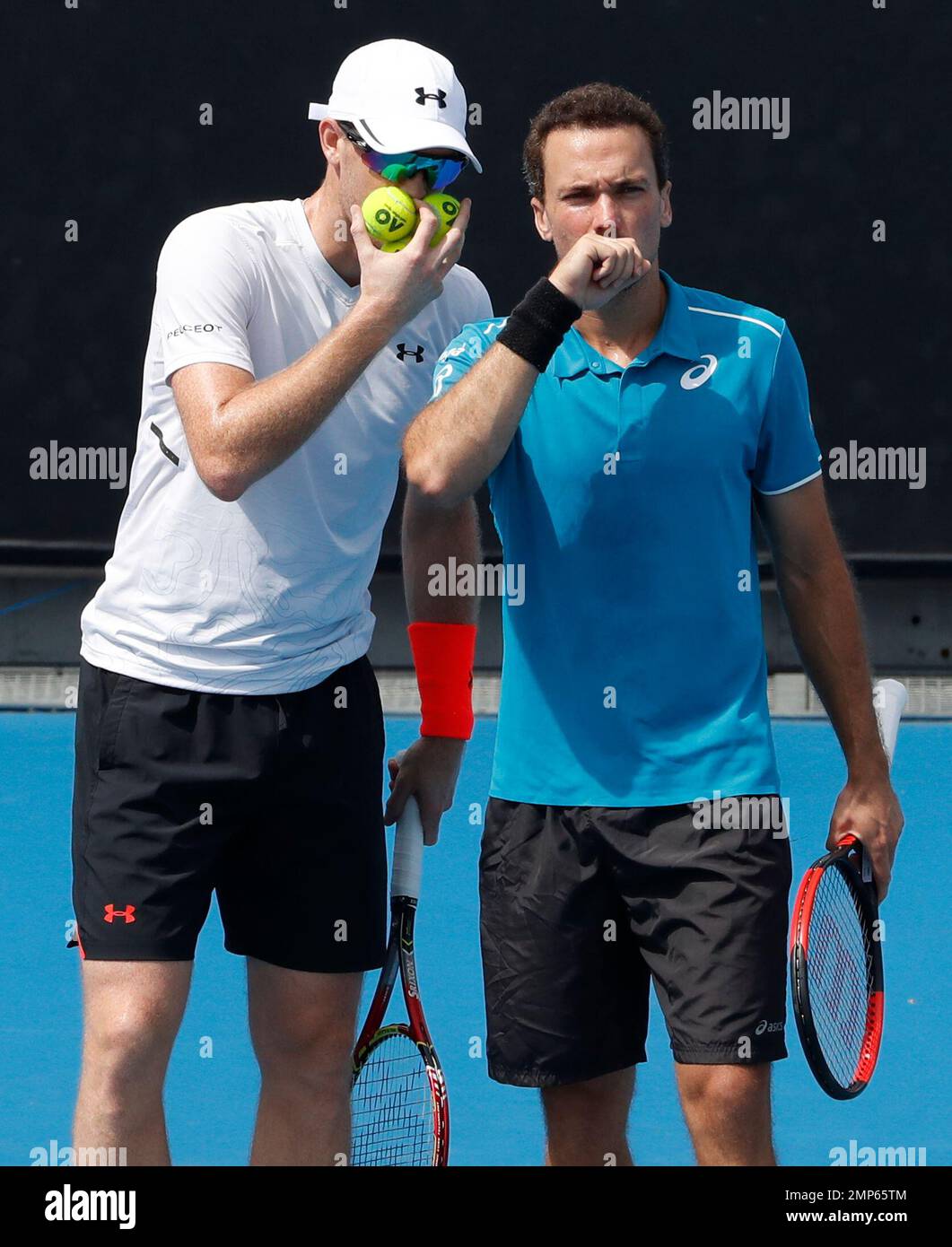 Britain's Jamie Murray, left, and Brazil's Bruno Soares talk during ...