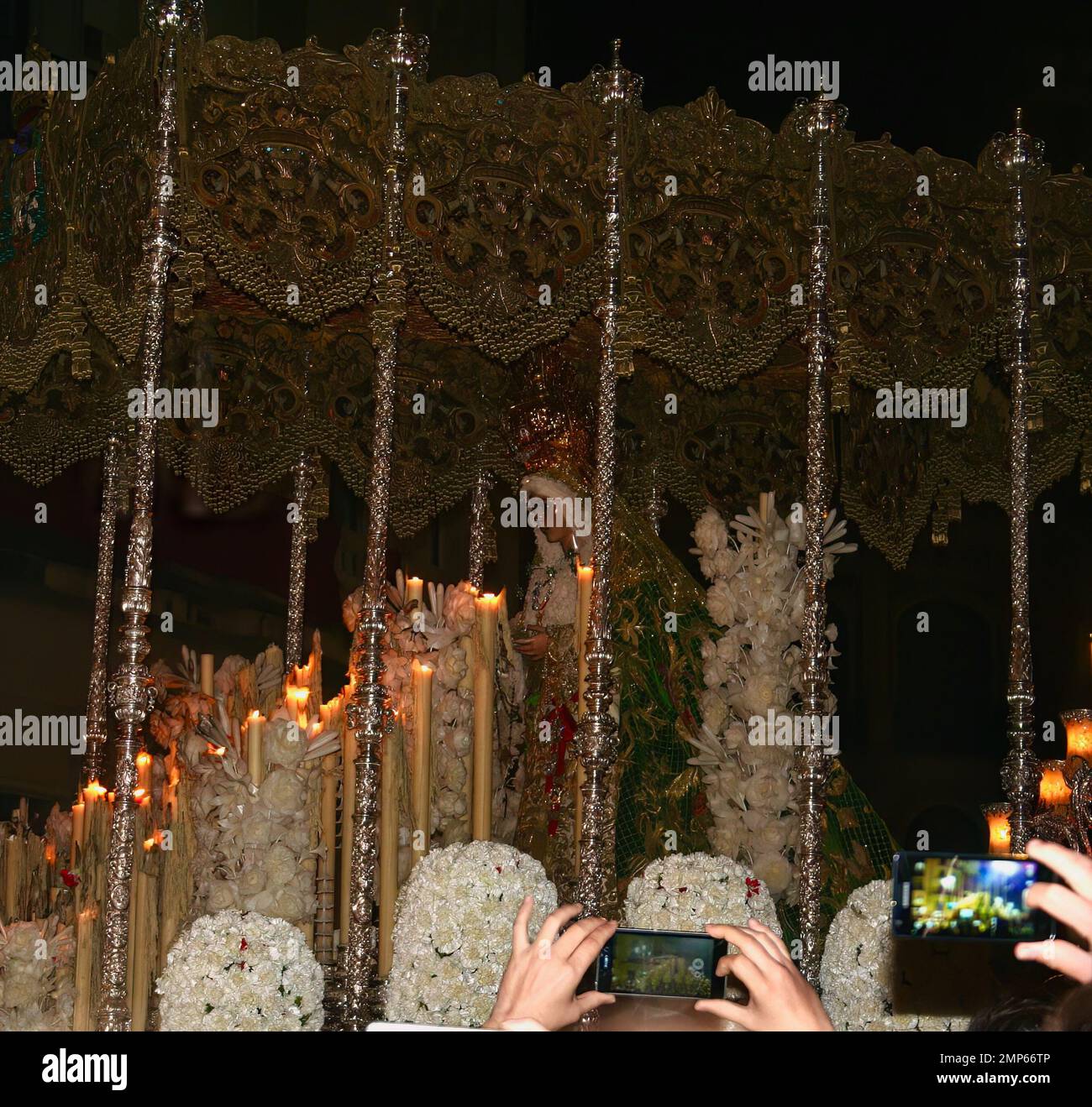 Paso with a statue of St Mary underneath a baldachin or canopy during a ...