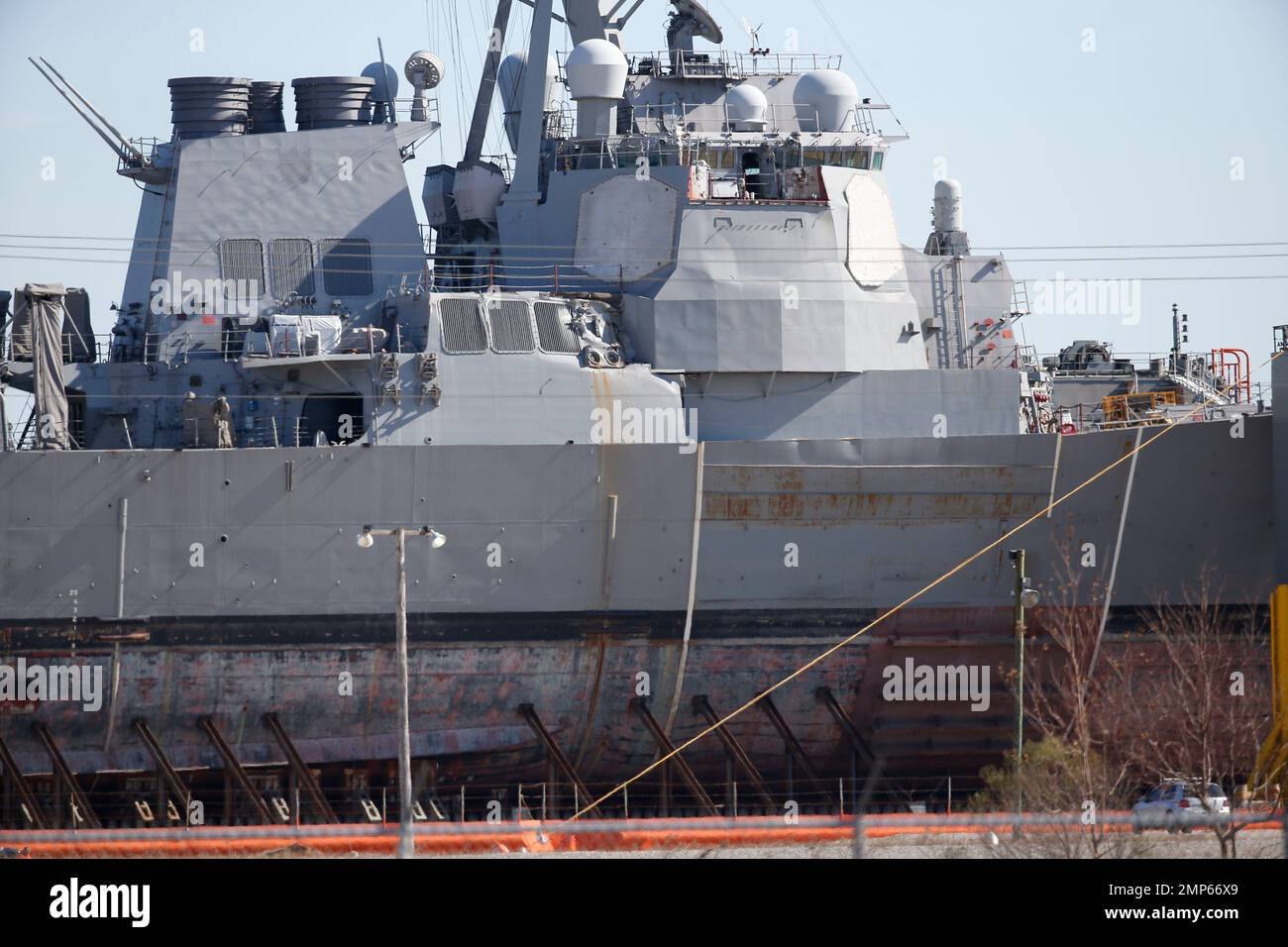 The repairs to the damaged starboard of the USS Fitzgerald can be seen ...