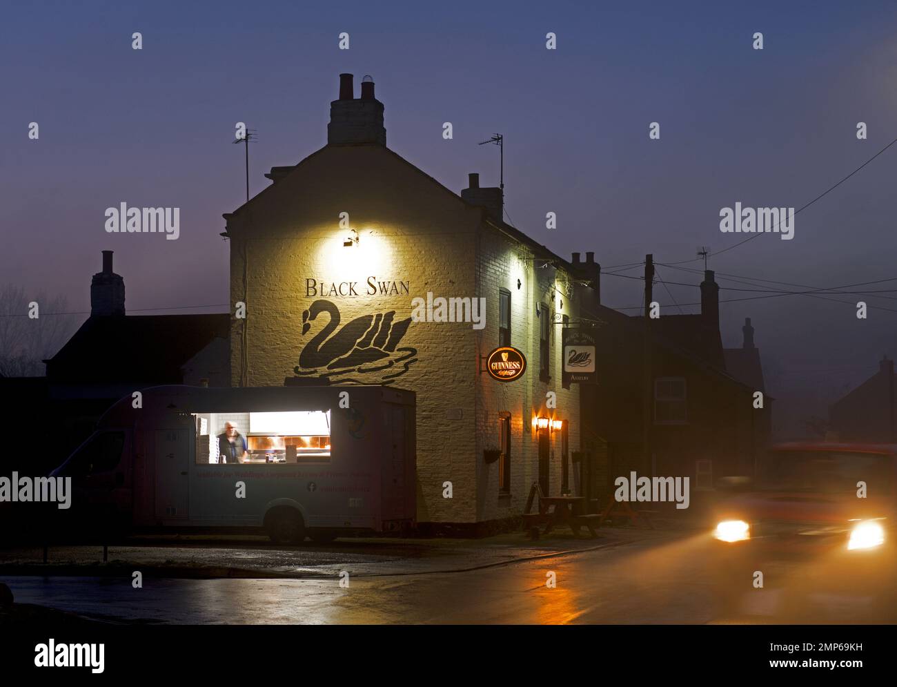 Fish & chip van, parked next the the Black Swan pub, in the village of ...