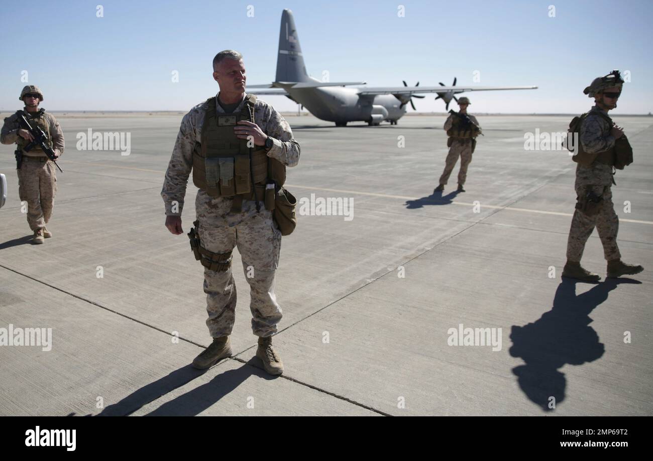 Out going U.S. Marine Brigadier General Roger B. Turner walks on the ...