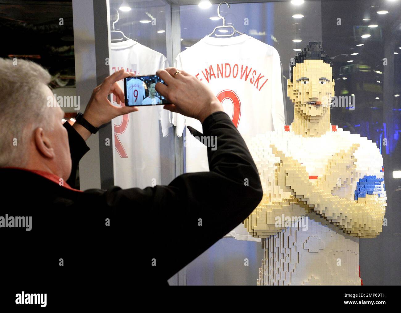 A visitor takes pictures of a life size figure of Bayern Munich soccer ...