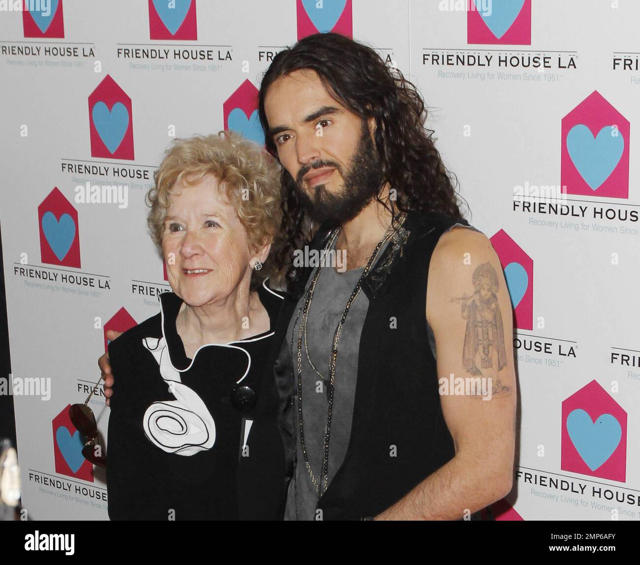 Peggy Albrecht and Russell Brand at the Friendly House LA Annual Awards ...