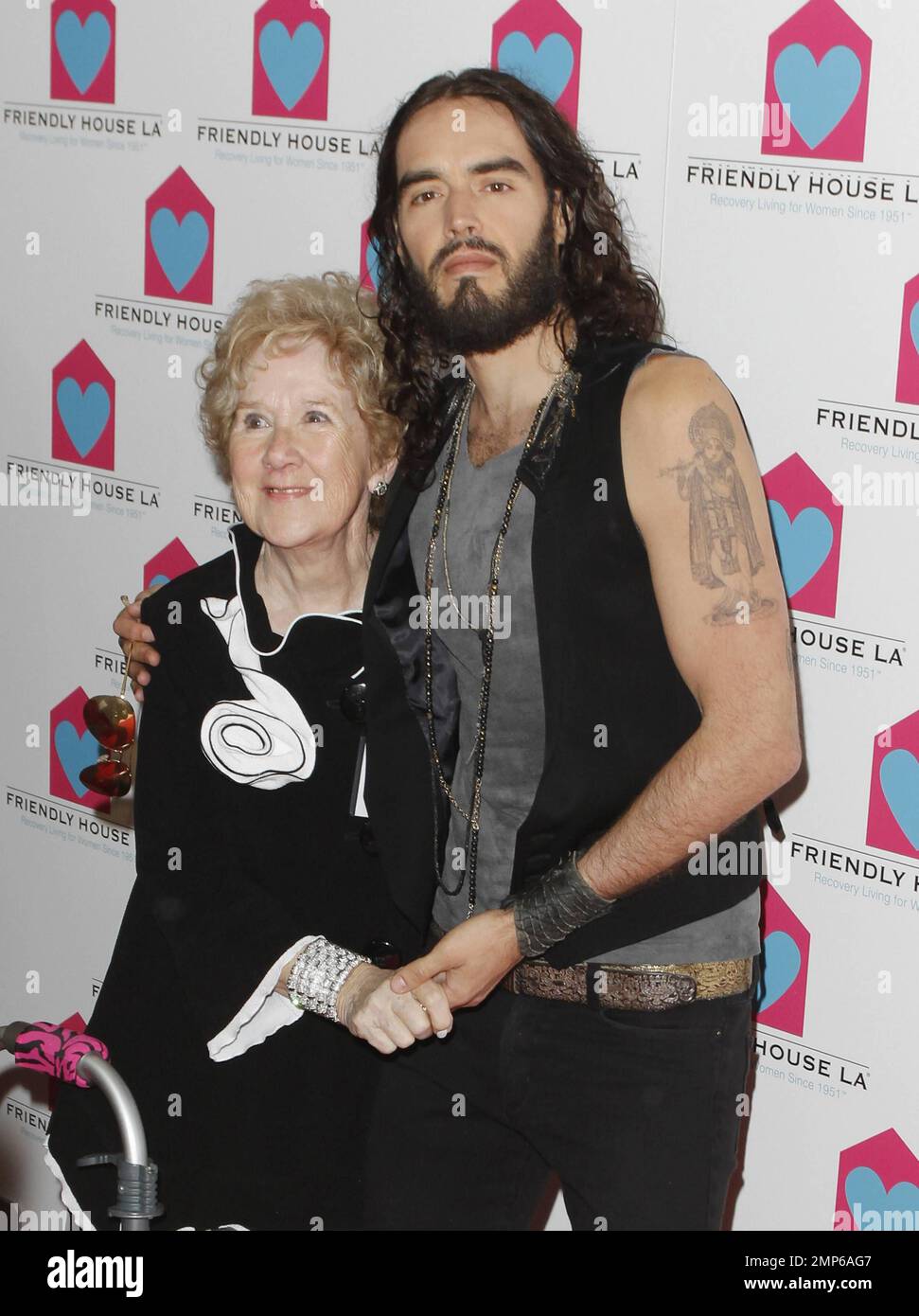 Peggy Albrecht and Russell Brand at the Friendly House LA Annual Awards ...