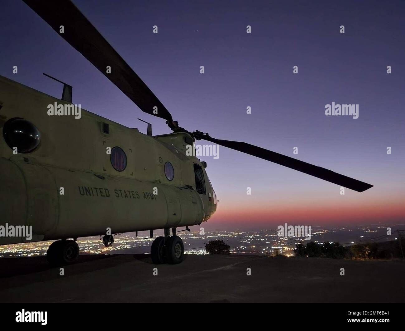 U.S. Army CH-47 Chinook helicopter, parked by aircrews of Bravo Company ...