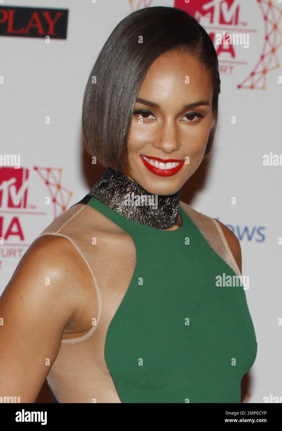 Singer Alicia Keys wears a green figure flattering dress at the 2012 ...