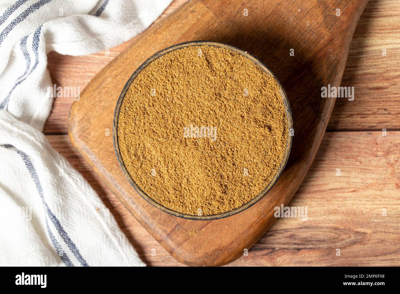 Powdered cumin spice. Cumin spice in bowl on wooden background. Dry ...