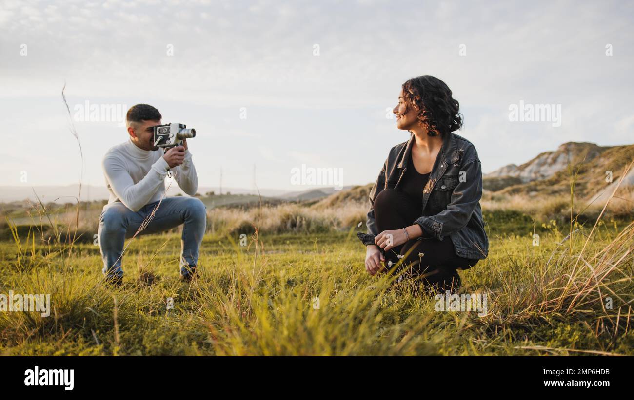 Boyfriend Filming His Girlfriend Outdoor Stock Photo - Alamy