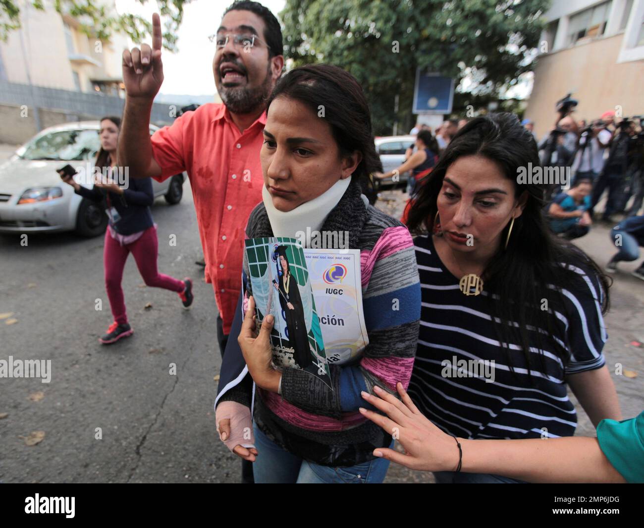 Lady Ramirez holds a photo of her sister, one of seven people who died ...