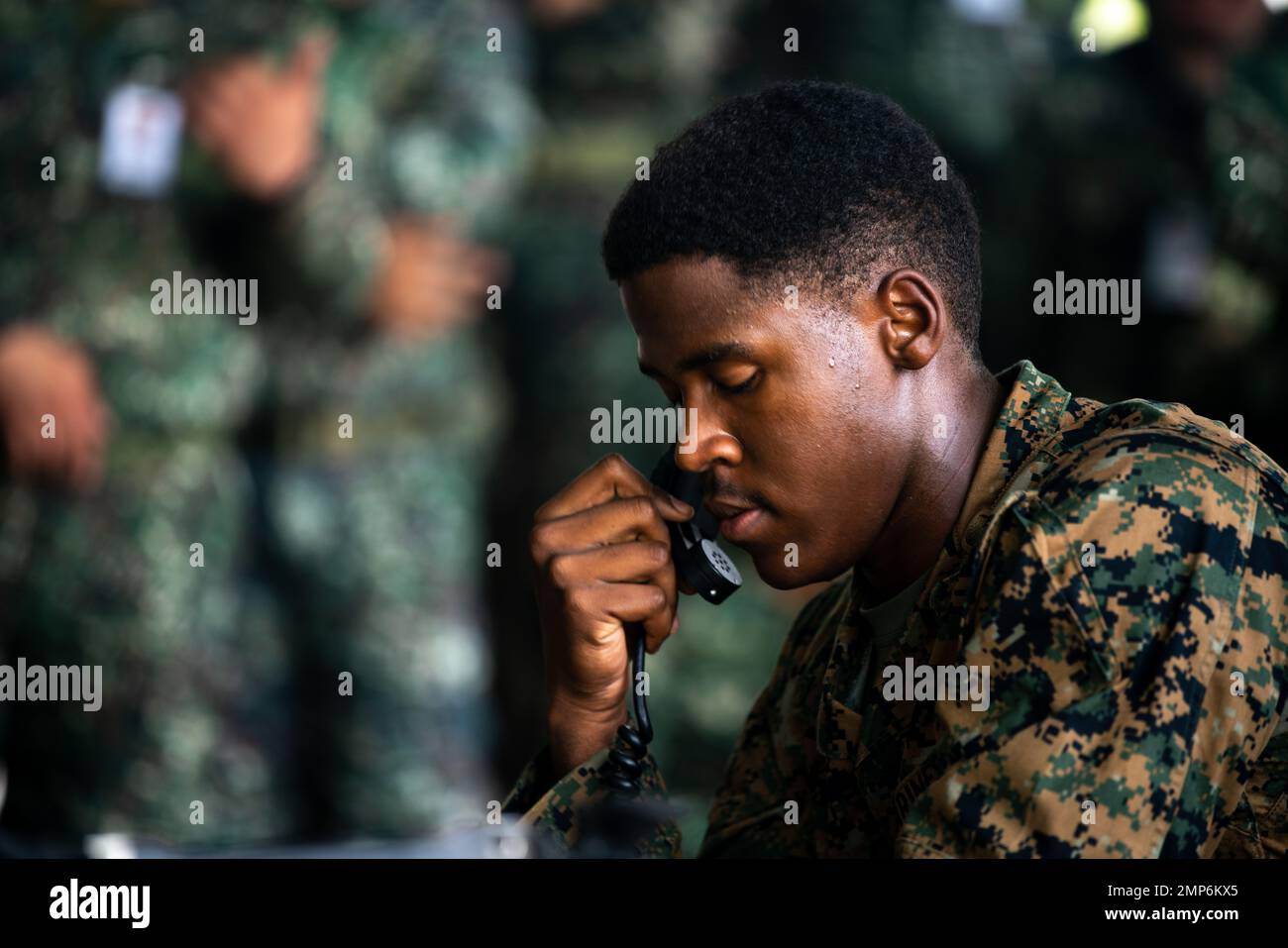 U.S. Marine Corps Cpl. Niles Jenkins, a radio operator with 3d Marine Division practices using a ...