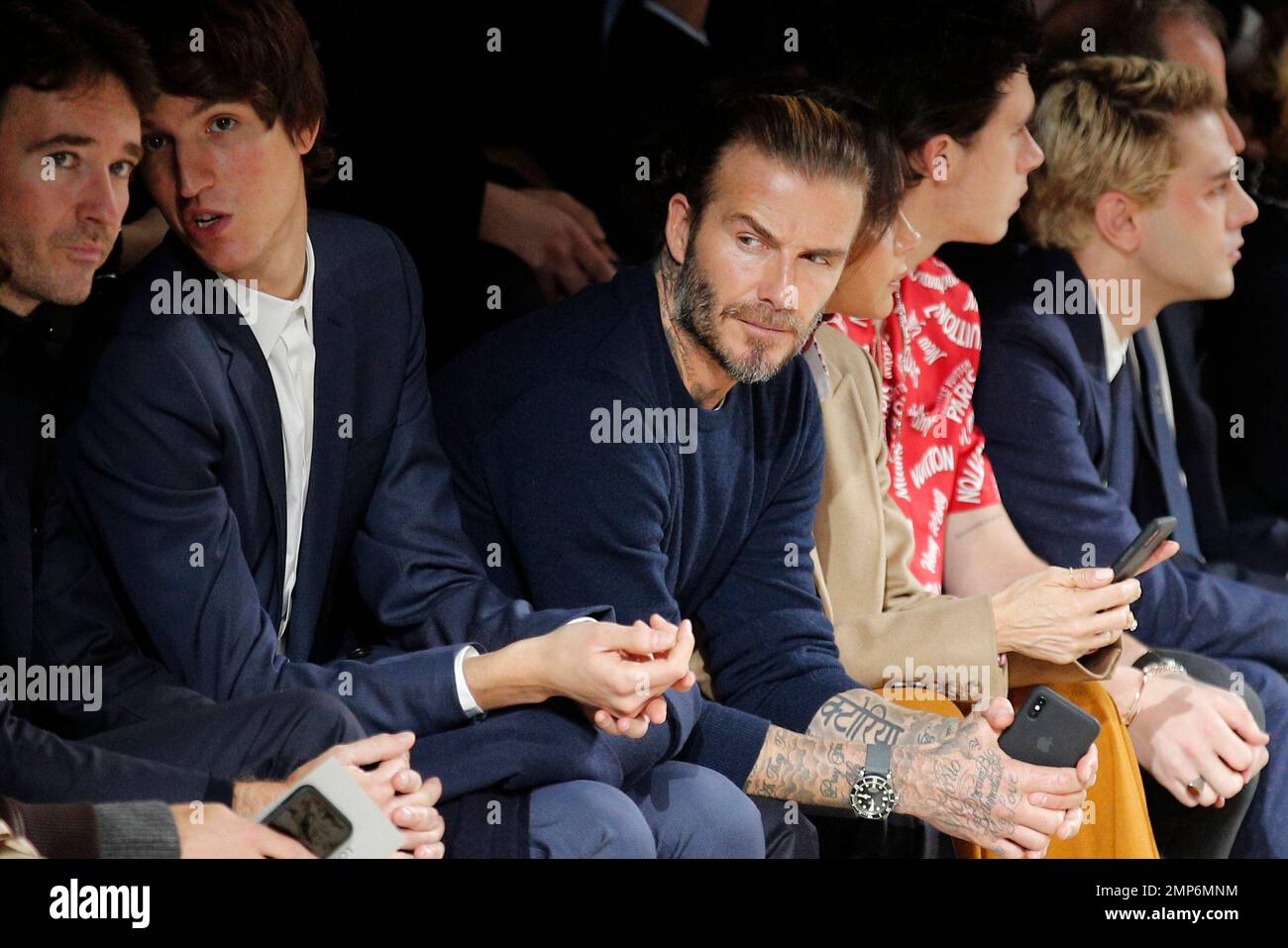 Former soccer player David Beckham, centre, watches the Louis Vuitton ...