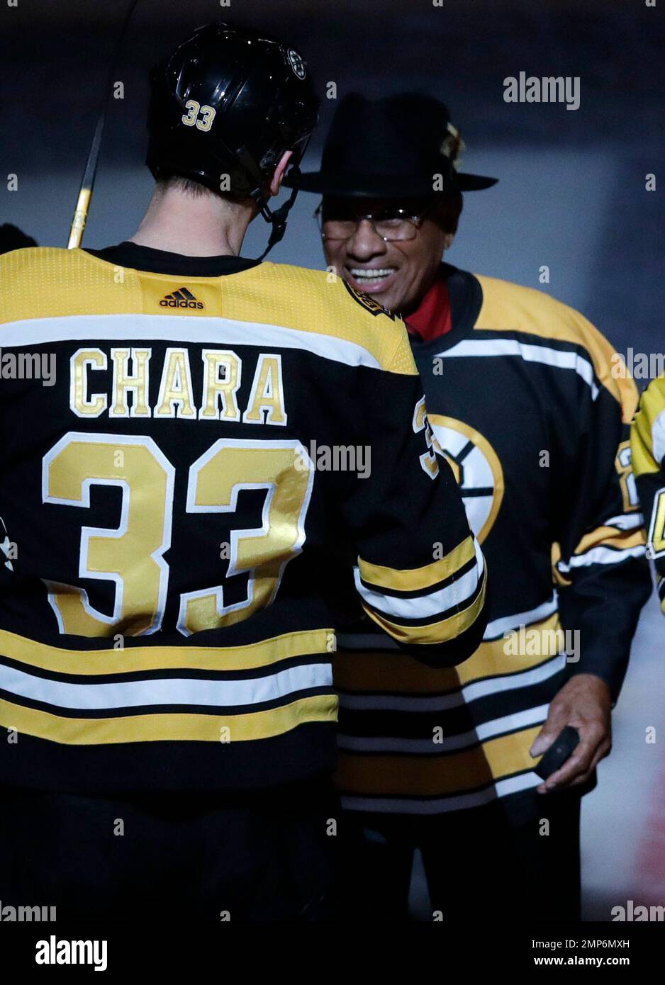 Boston Bruins great Willie O'Ree talks with Boston Bruins defenseman ...