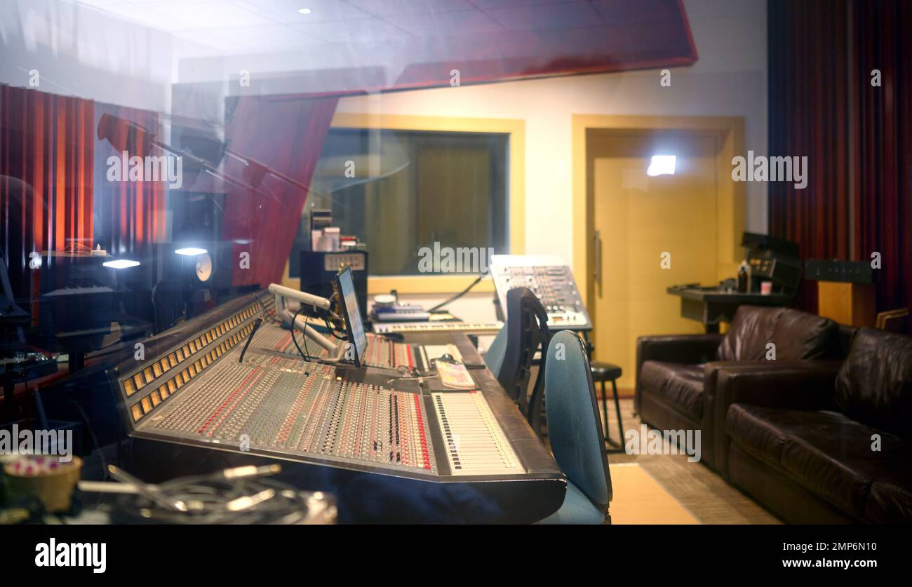 Music, studio and production with audio equipment in an empty room for ...
