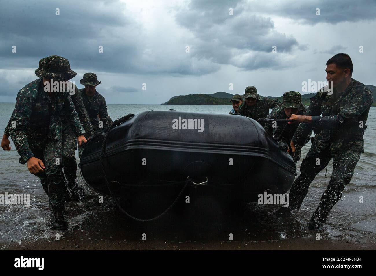 Philippine Marines with Marine Battalion Landing Team 10 conduct a combined amphibious raid with ...