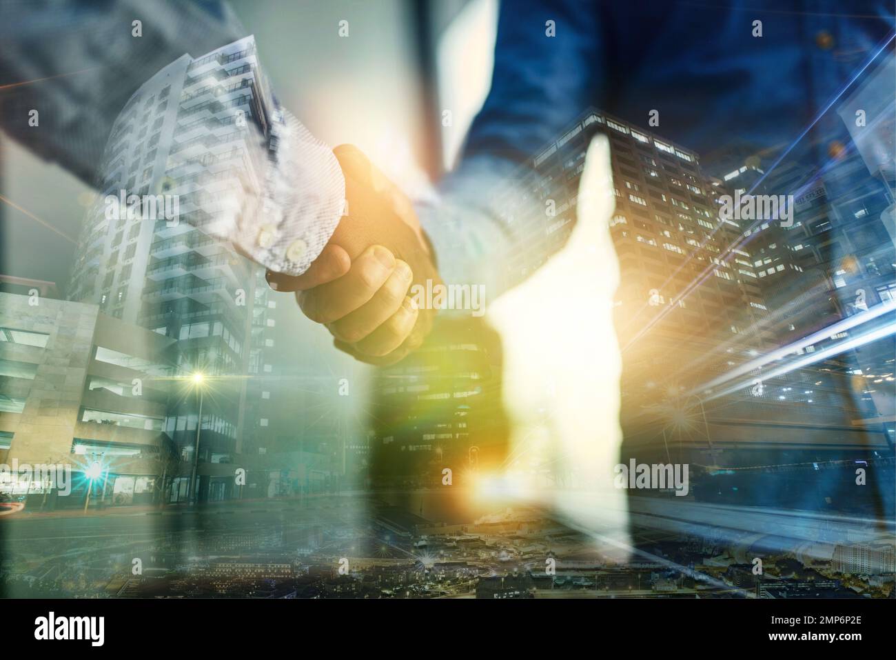 Digital, city or deal with business people shaking hands in agreement ...