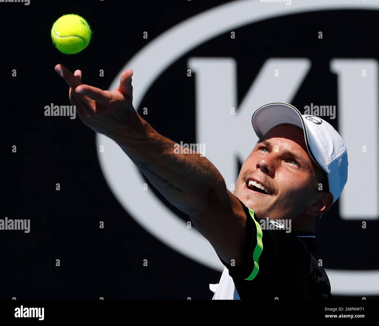 Hungary's Marton Fucsovics serves to United States' Sam Querrey during ...