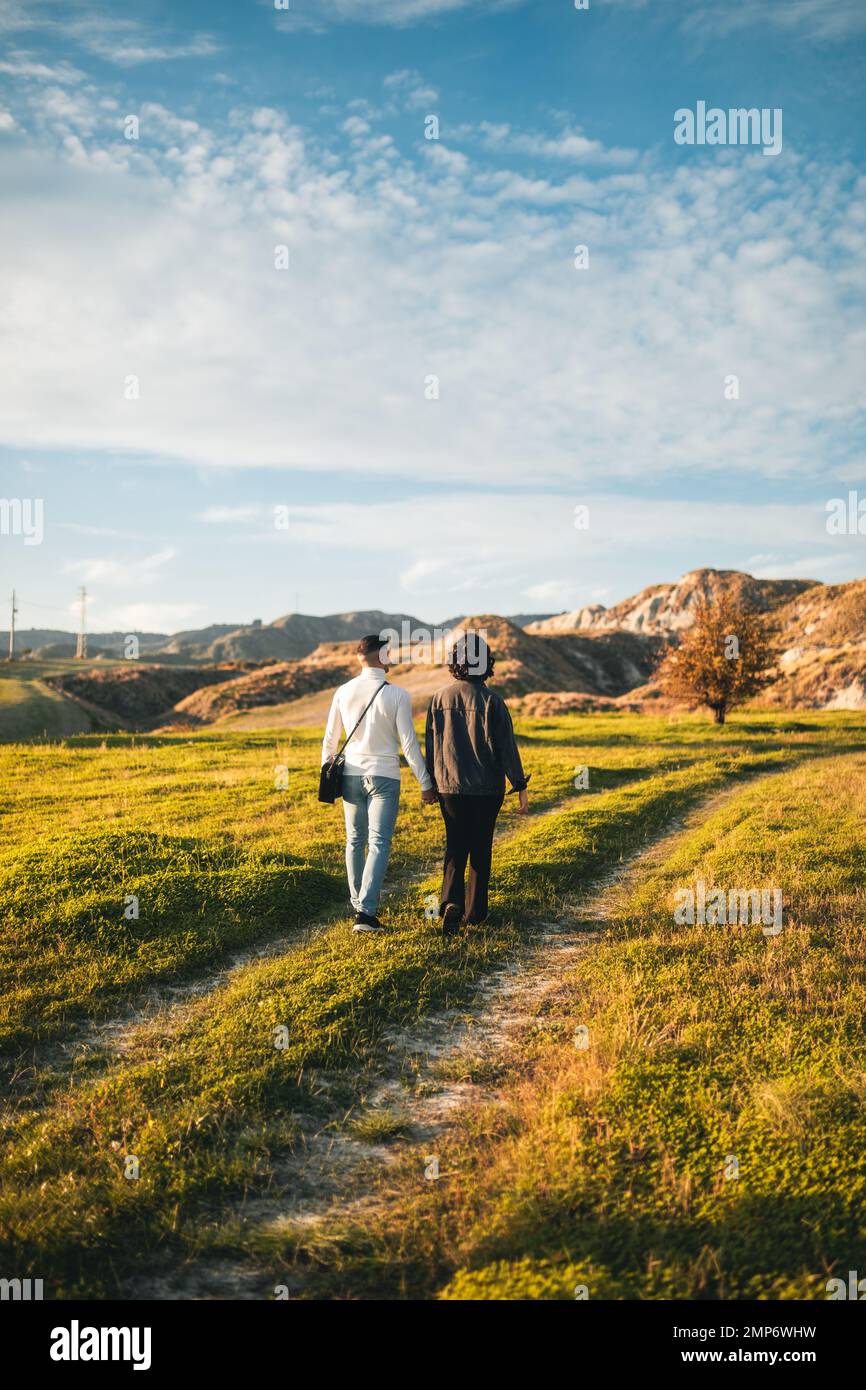 Lovers walking hand in hand hi-res stock photography and images - Alamy