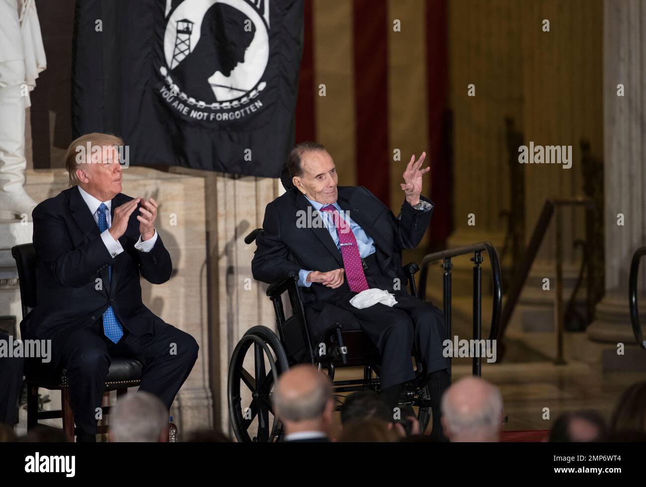 Former Senate Majority Leader Bob Dole, center, acknowledges applause ...