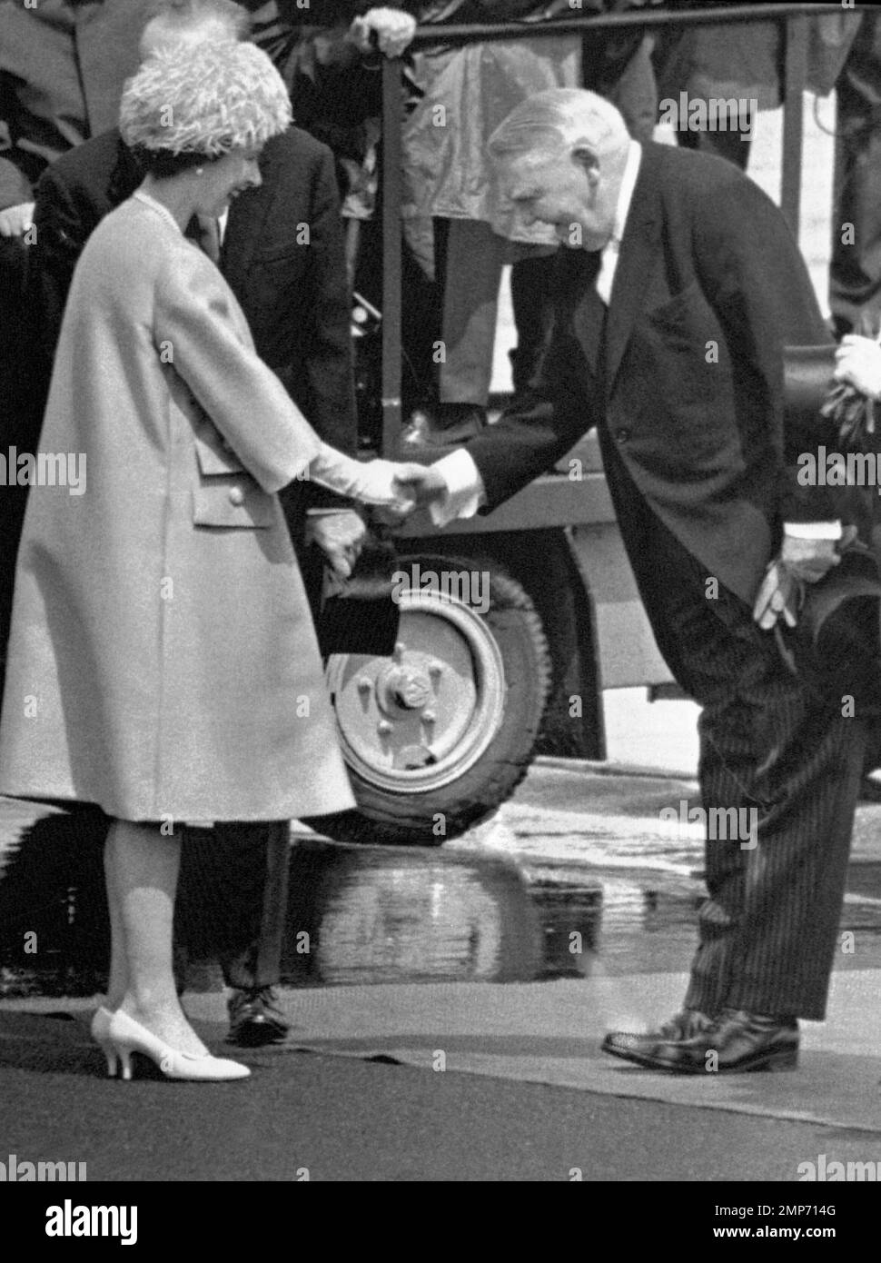 Queen Elizabeth II shakes hands with west German Chancellor Ludwig ...
