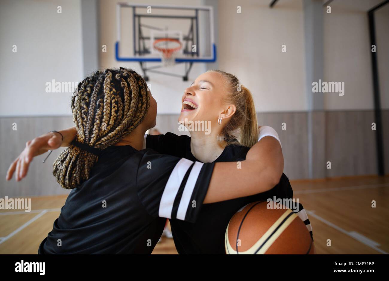 Women, sports team players, in gym celebrating victory Stock Photo - Alamy