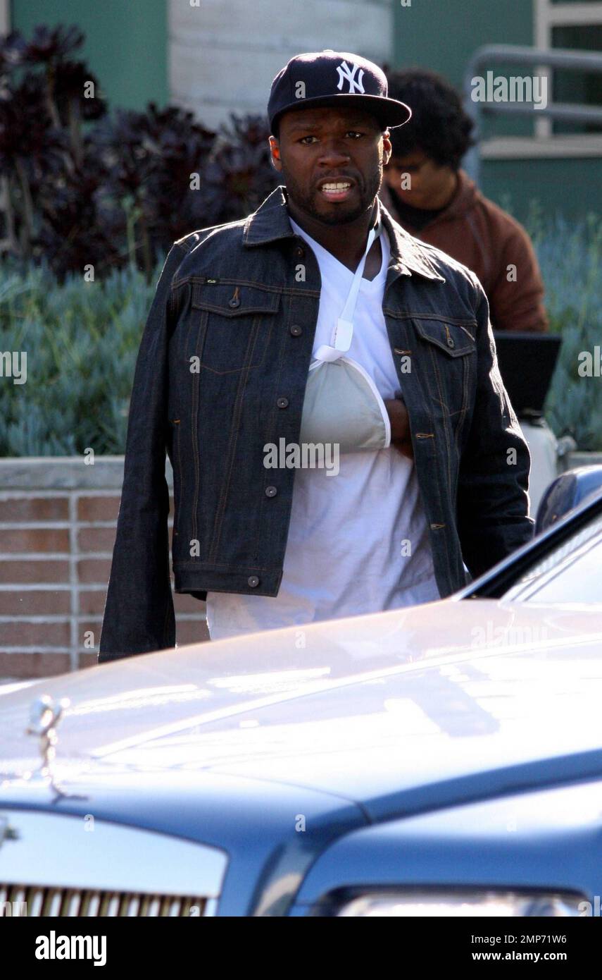 Rapper 50 Cent leaves the "Chelsea Lately" show studios with his arm in ...