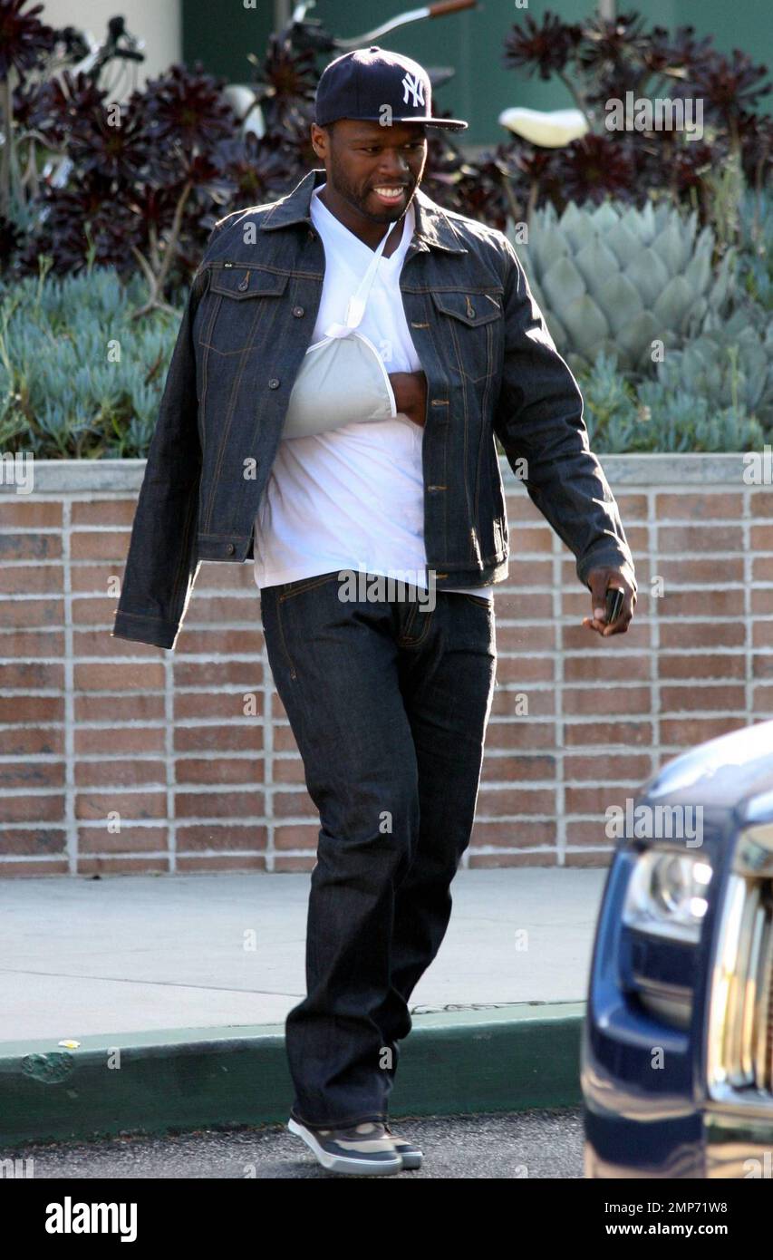 Rapper 50 Cent leaves the "Chelsea Lately" show studios with his arm in ...