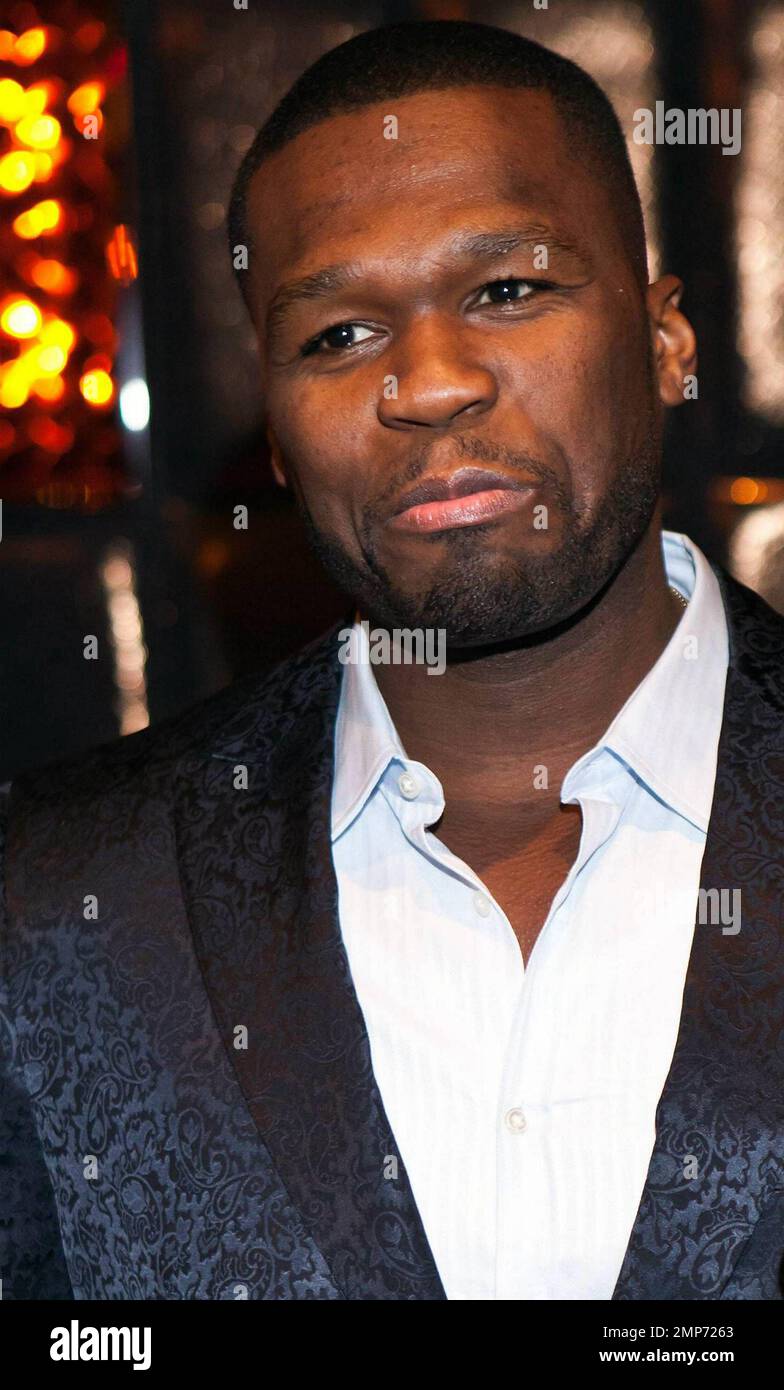 50 Cent (aka Curtis Jackson) wears a tailored paisley patterned jacket ...