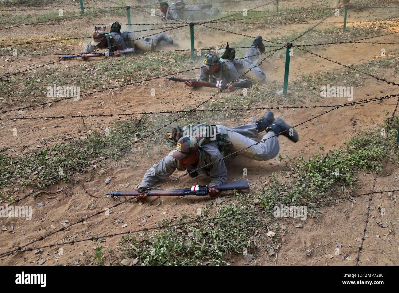 Indian army soldiers crawl under barbed wires as they showcase their ...
