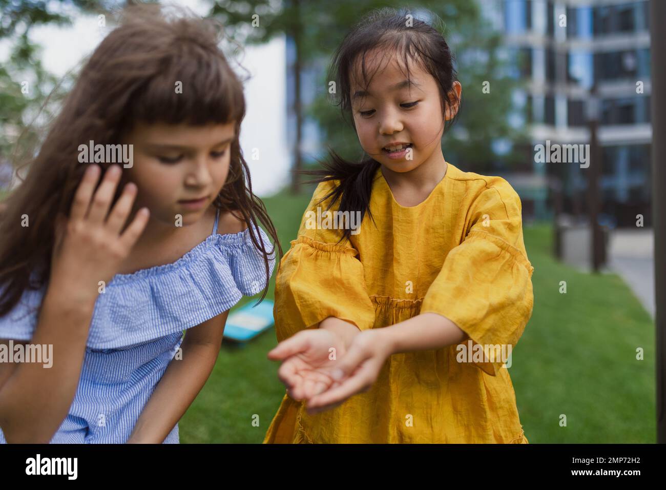Children talking together park hi-res stock photography and images - Alamy