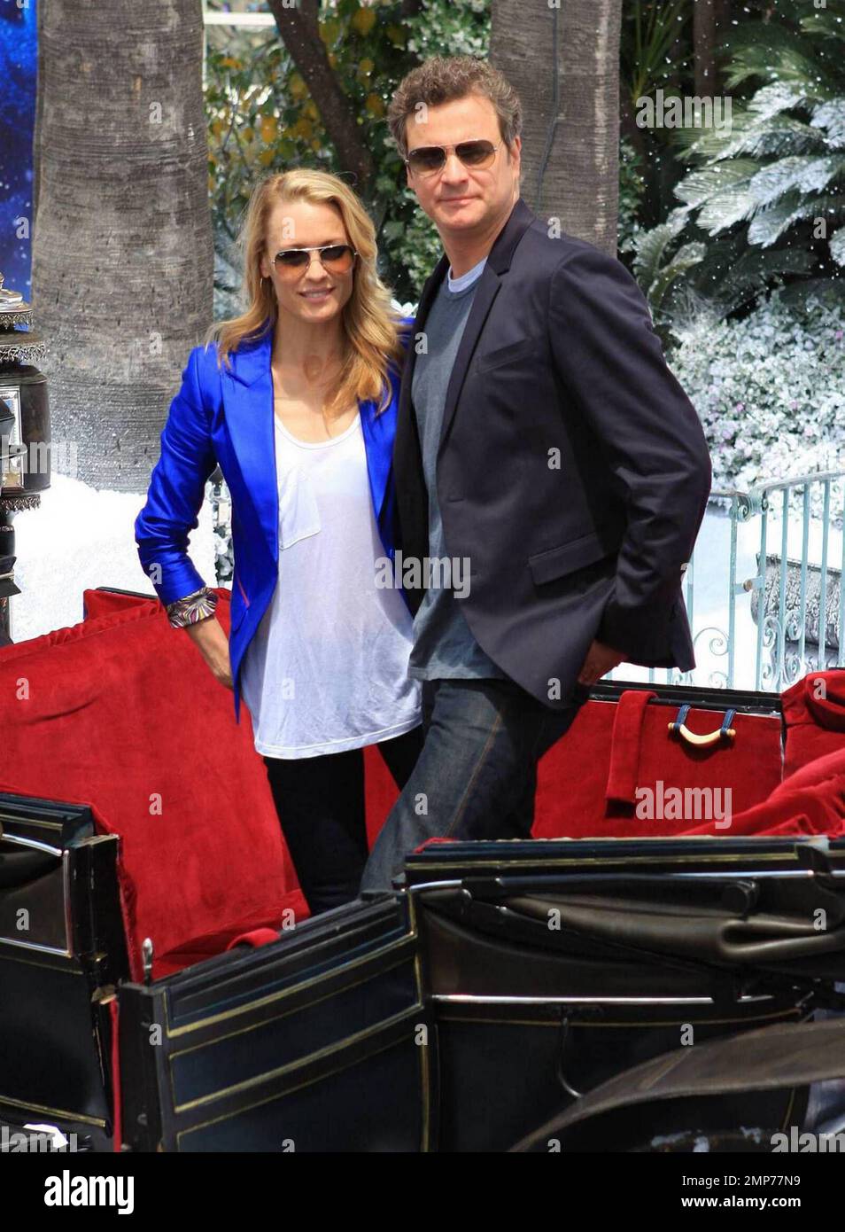 Colin Firth and Robin Wright Penn arrive in a horse-drawn carriage at ...