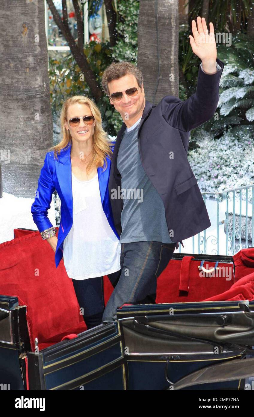 Colin Firth and Robin Wright Penn arrive in a horse-drawn carriage at ...