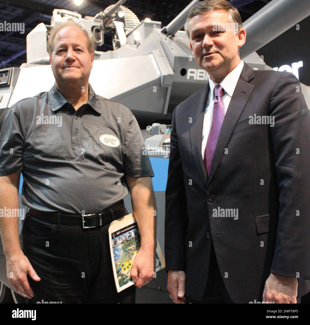 At right, Douglas R. Bush, Assistant Secretary of the Army for ...