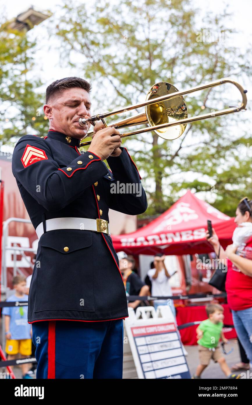 U.S. Marine Corps Corporal Jacob Everett plays the trombone as the ...