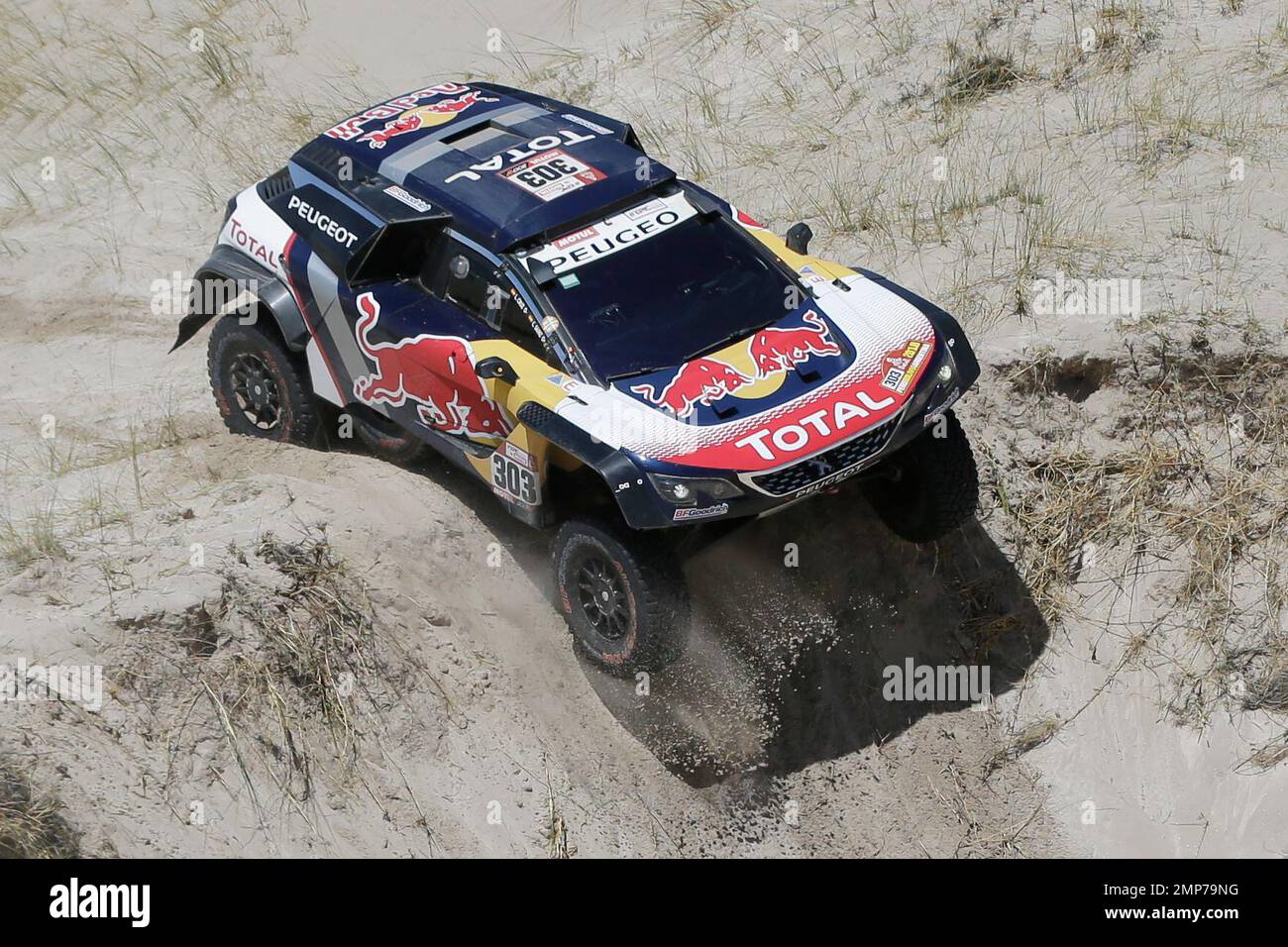 Driver Carlos Sainz, of Spain, and co-driver Lucas Cruz, of Spain, race ...