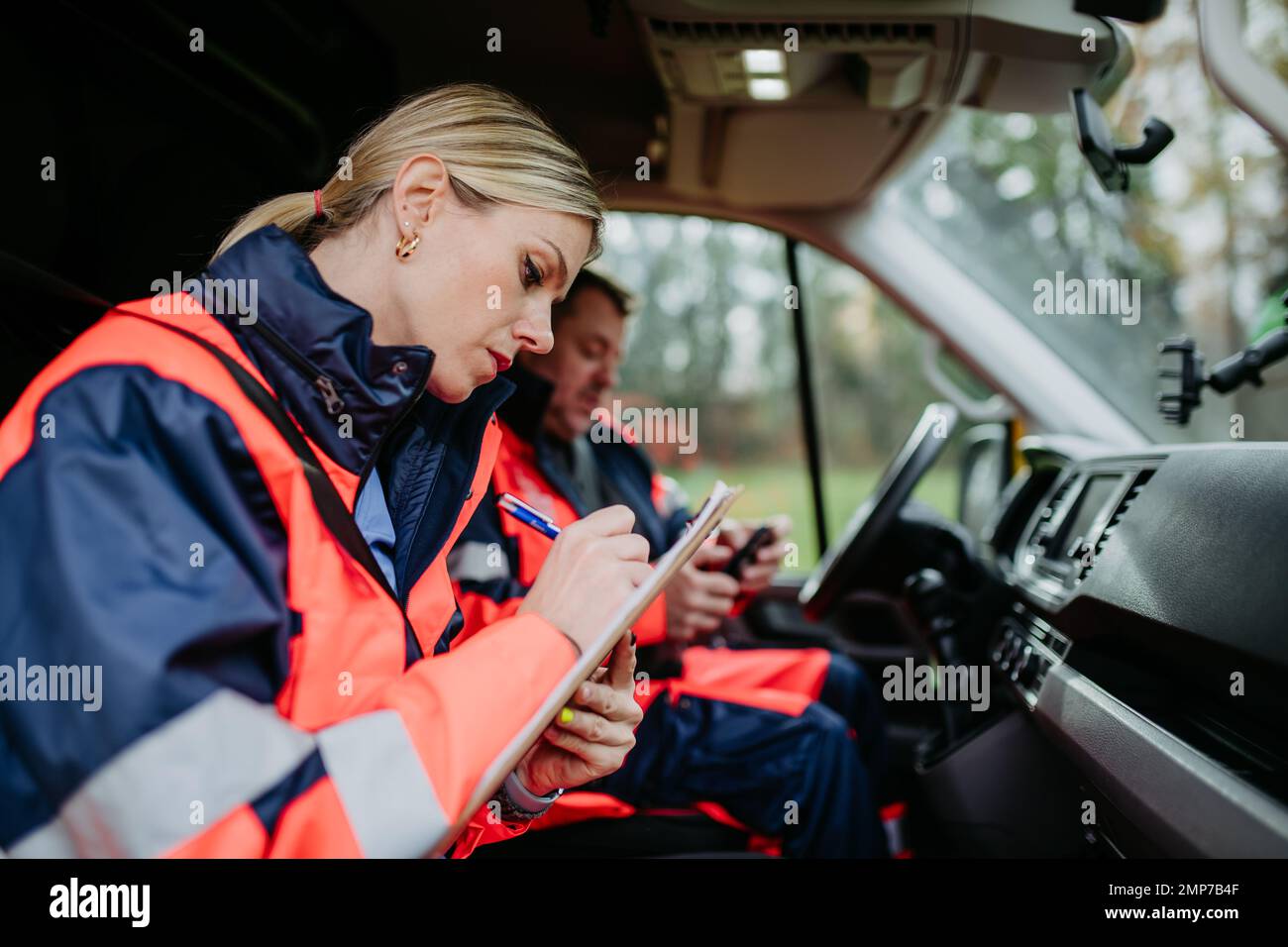Team of rescuers preparing in ambulance car to outdoor operation Stock ...