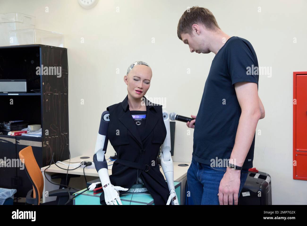 In this Sept. 28, 2017, photo, a staff member of Hanson Robotics sets ...