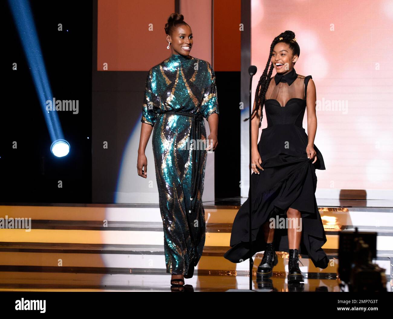 Issa Rae, left, and Yara Shahidi walk on stage to present the award for ...