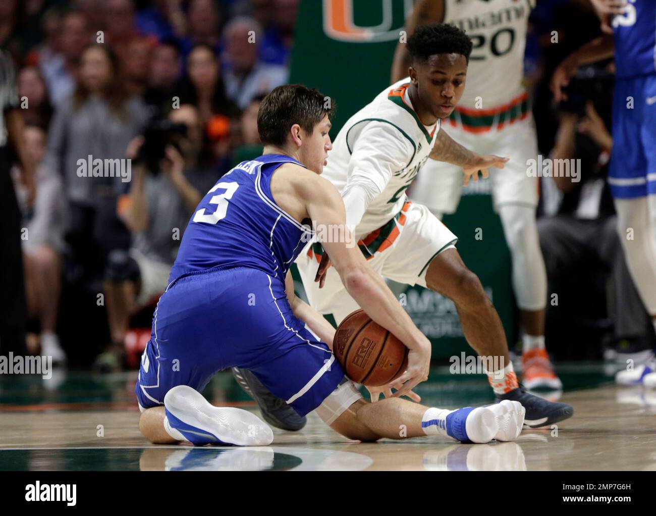 Duke's Grayson Allen (3) loses the ball as Miami's Chris Lykes defends ...