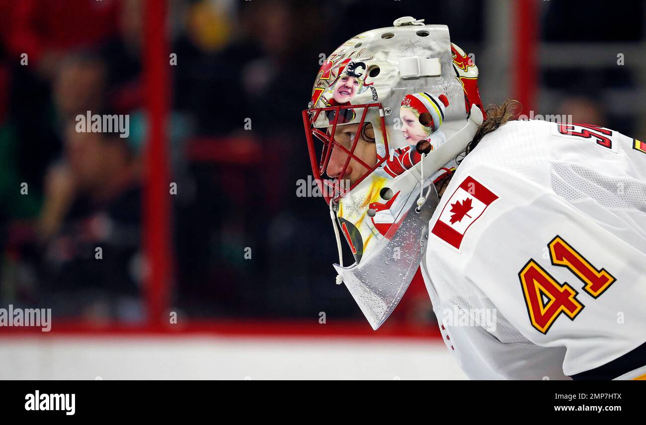 Calgary Flames goaltender Mike Smith (41) eyes the puck during the ...
