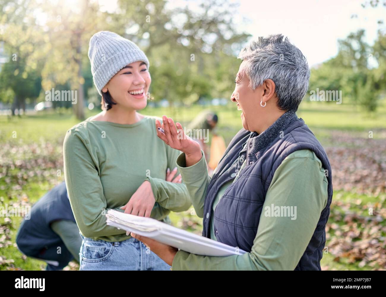 Communication, community volunteer and people cleaning garbage ...