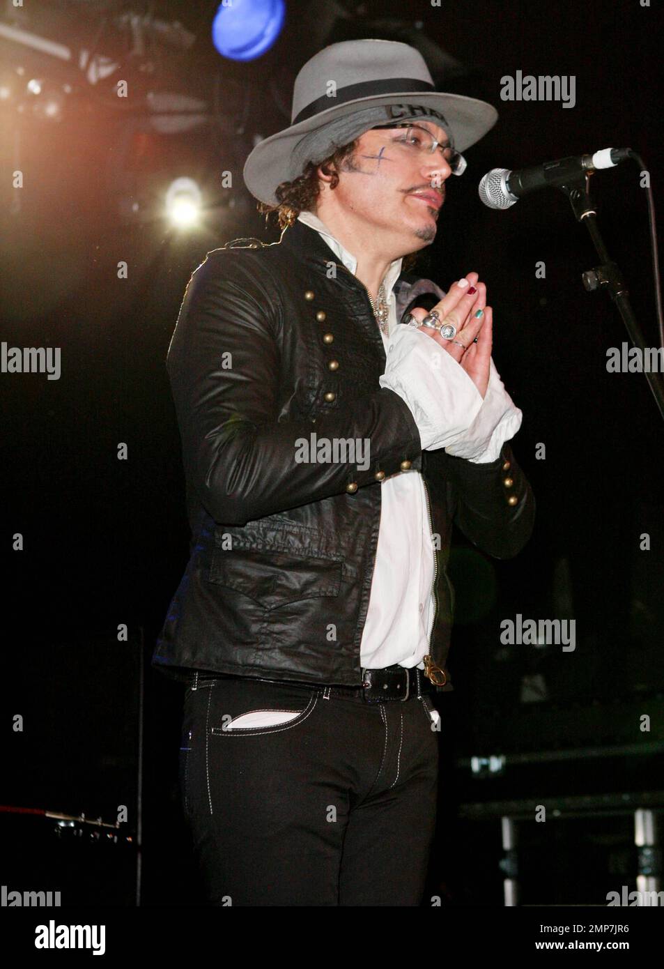 With his nails painted red and with a 'X' drawn on his cheek UK singer ...