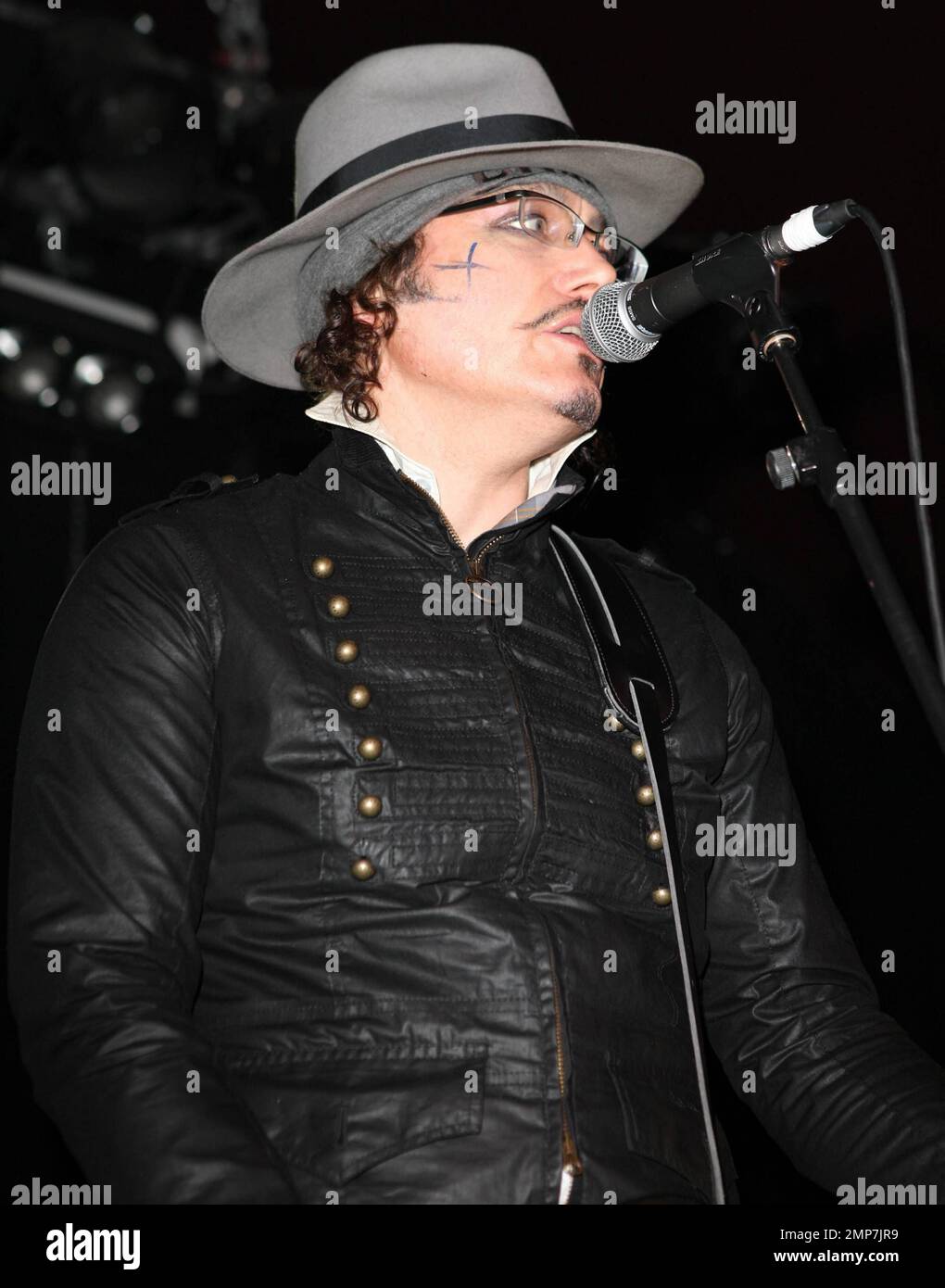 With his nails painted red and with a 'X' drawn on his cheek UK singer ...