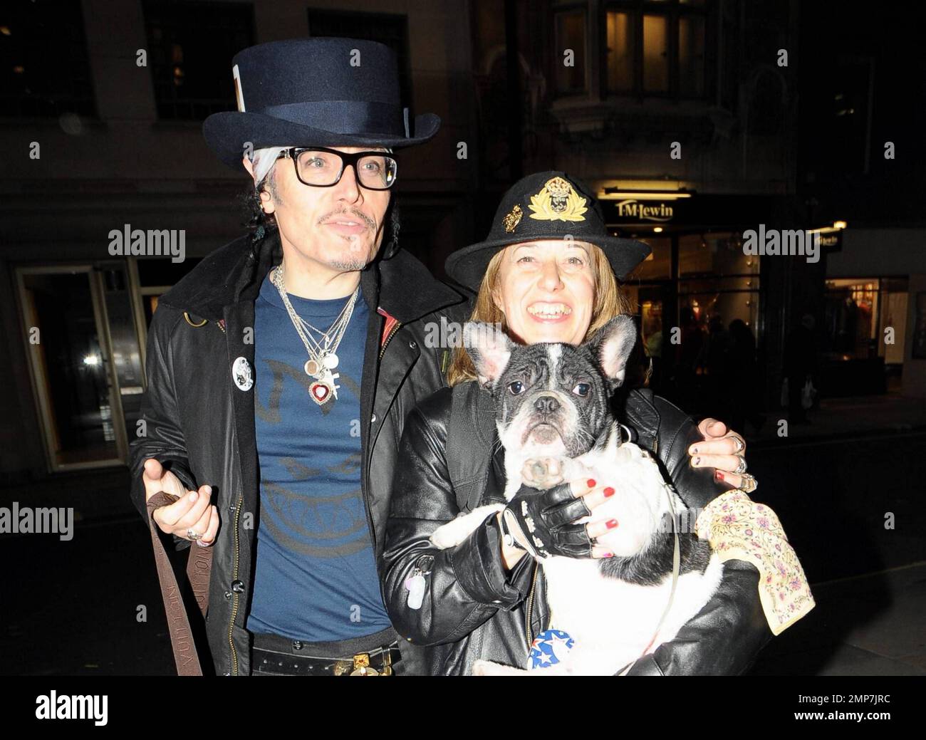 New wave/punk musician Adam Ant arrives with his dog Elvis and a friend ...