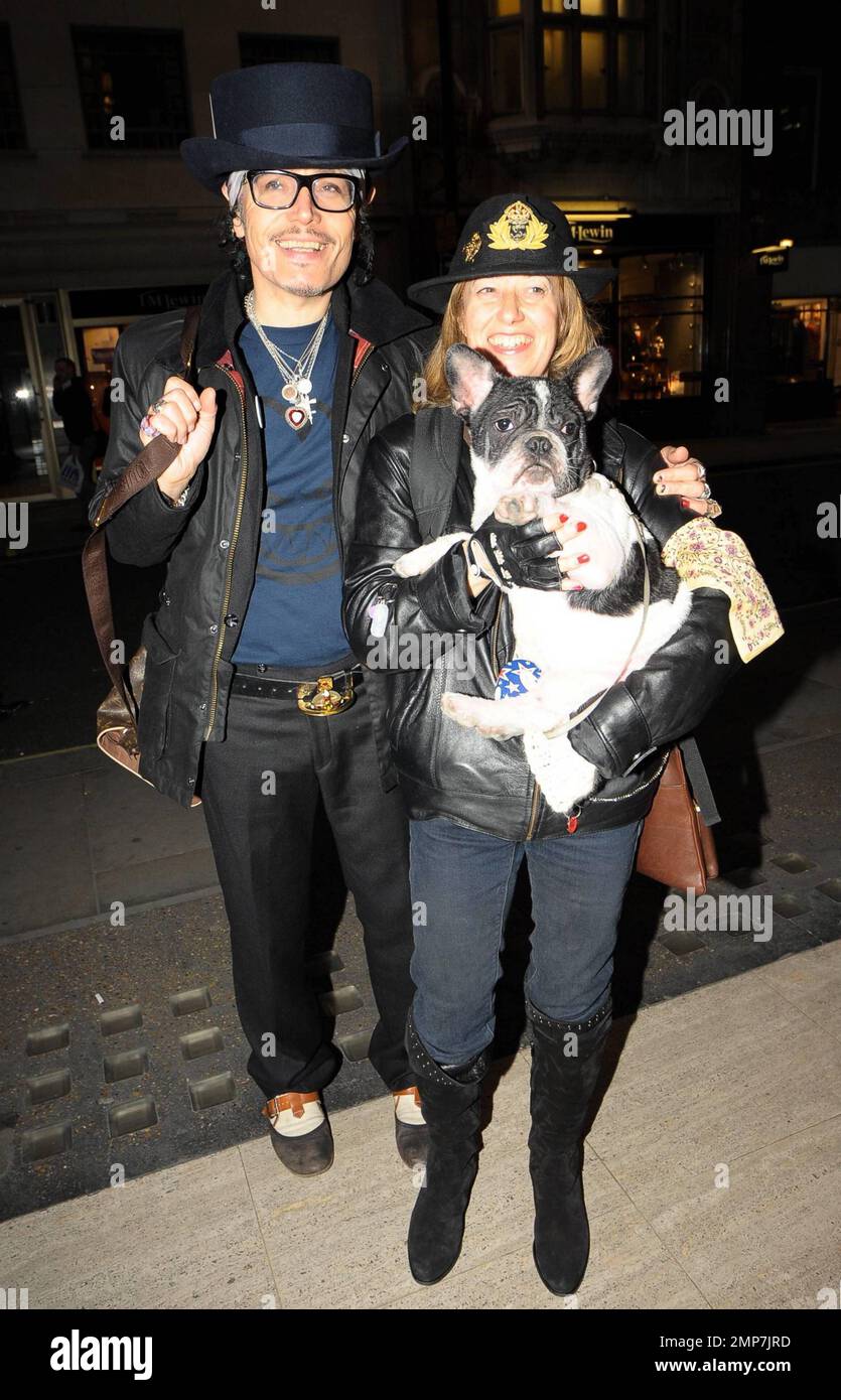 New wave/punk musician Adam Ant arrives with his dog Elvis and a friend ...