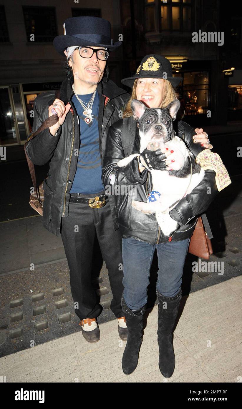 New wave/punk musician Adam Ant arrives with his dog Elvis and a friend ...