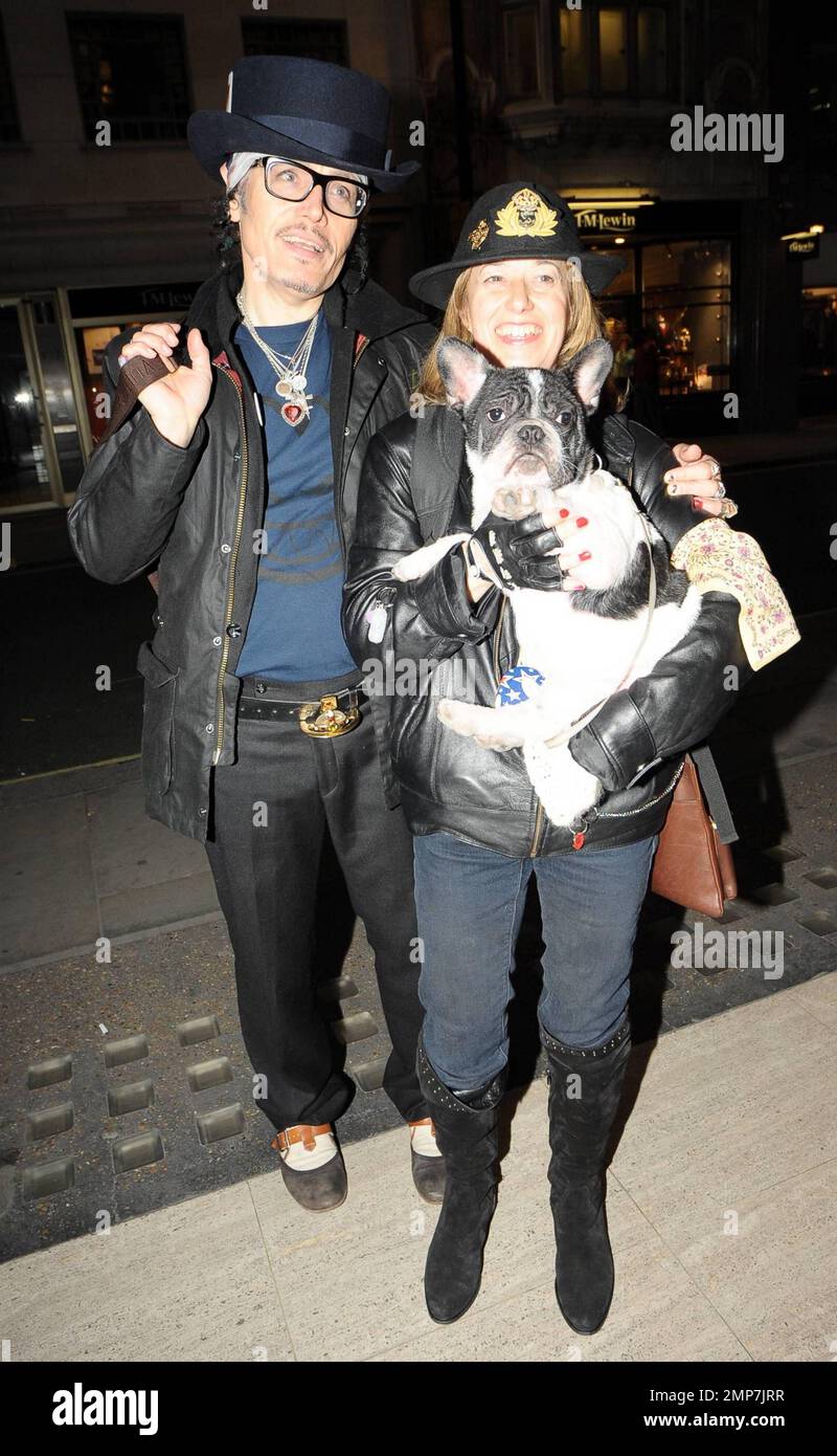 New wave/punk musician Adam Ant arrives with his dog Elvis and a friend ...