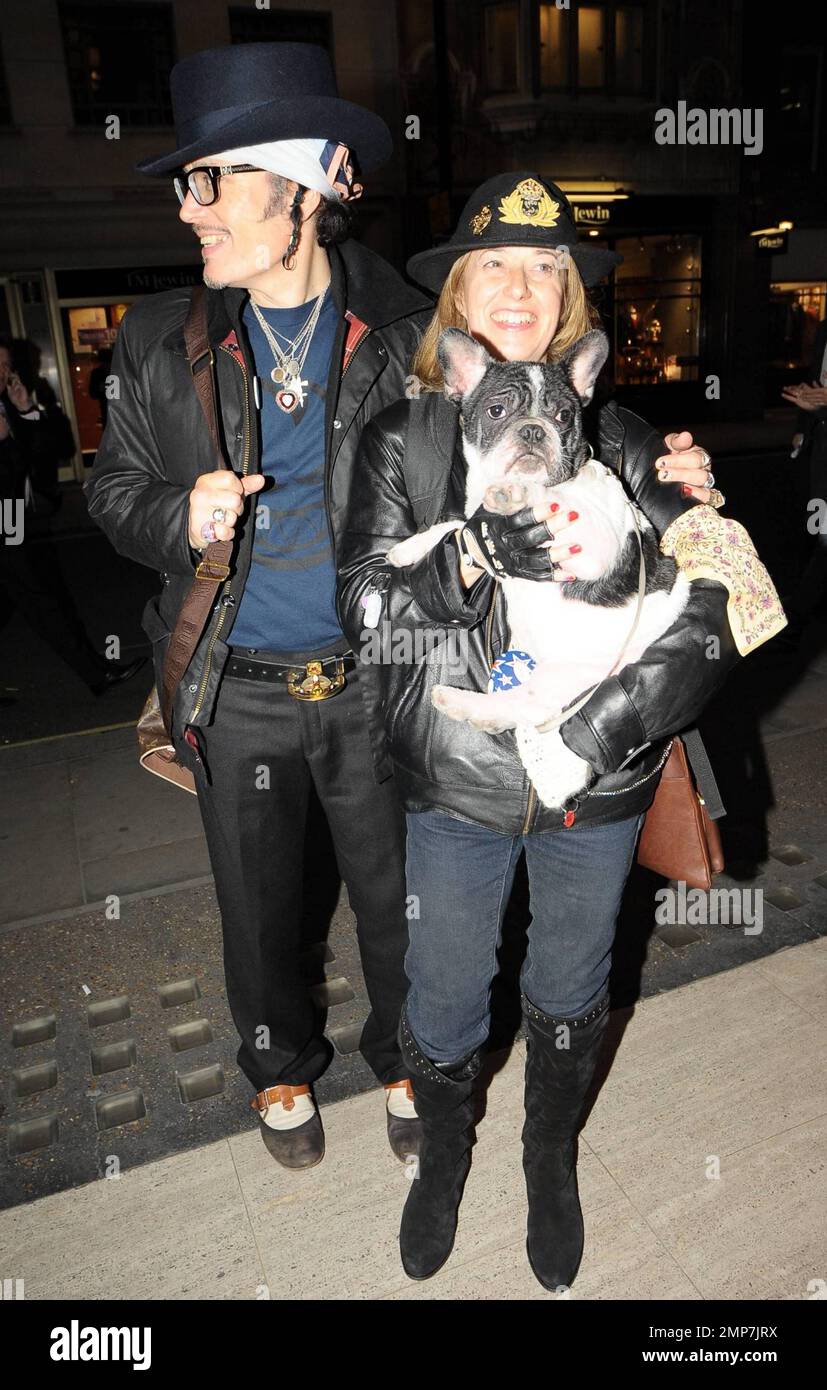 New wave/punk musician Adam Ant arrives with his dog Elvis and a friend ...
