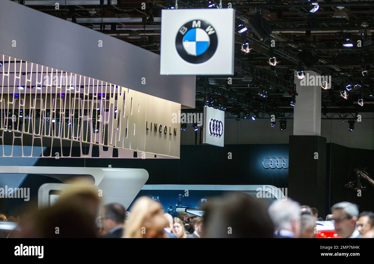 Automotive marques for BMW, Lincoln, and Audi hang above their ...